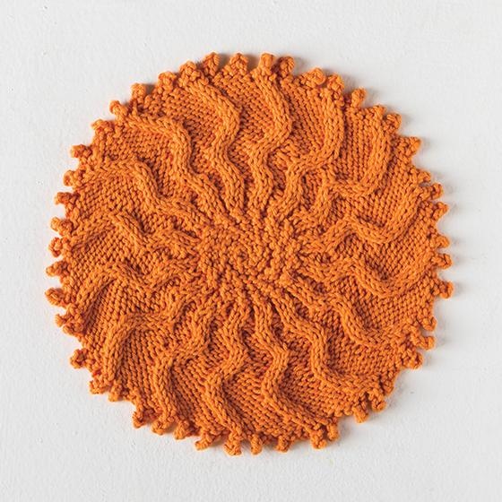 Cabled Sunburst Washcloth - Premium Knitting Patterns